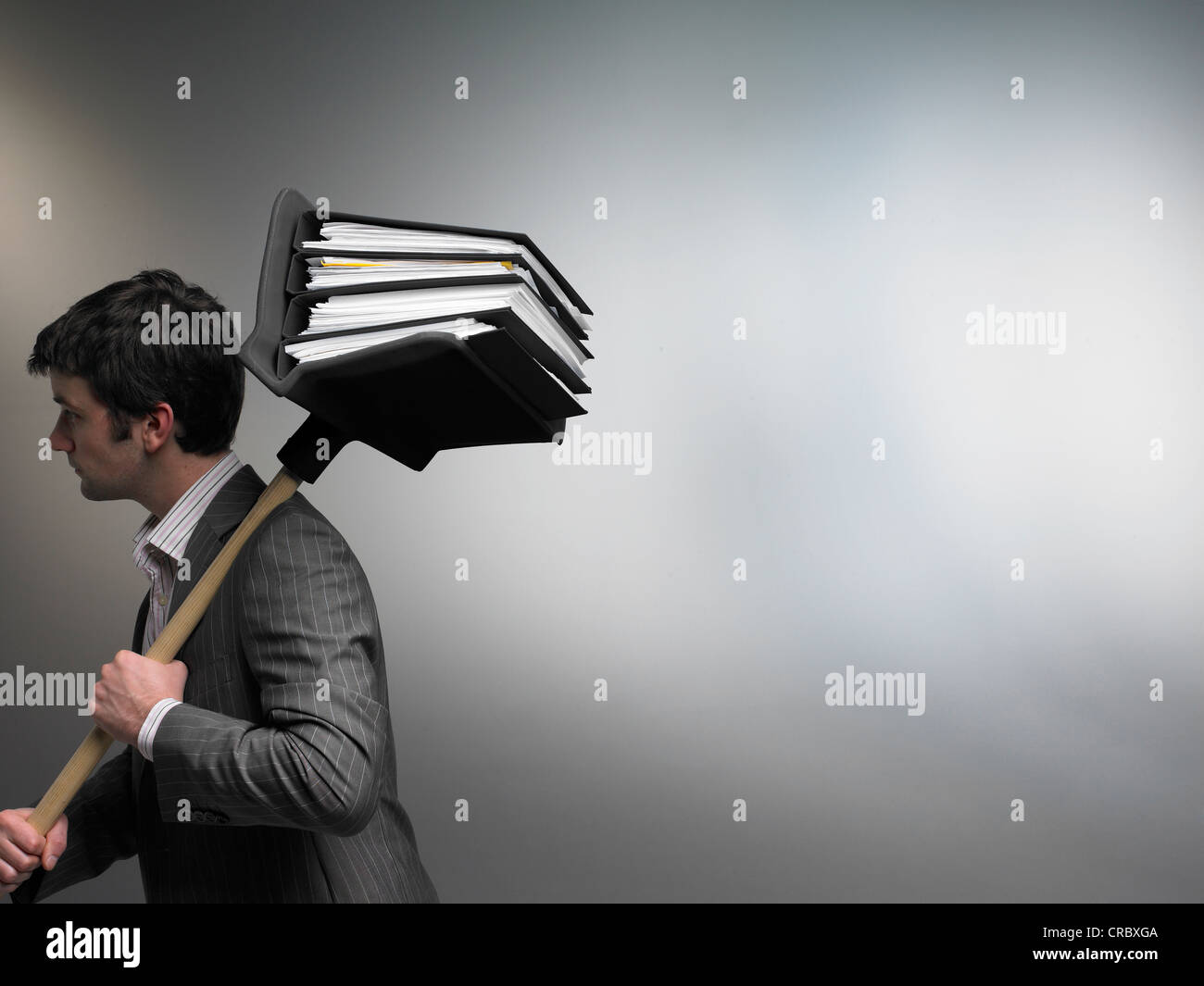 business man carrying files and folders in a brick hod Stock Photo - Alamy