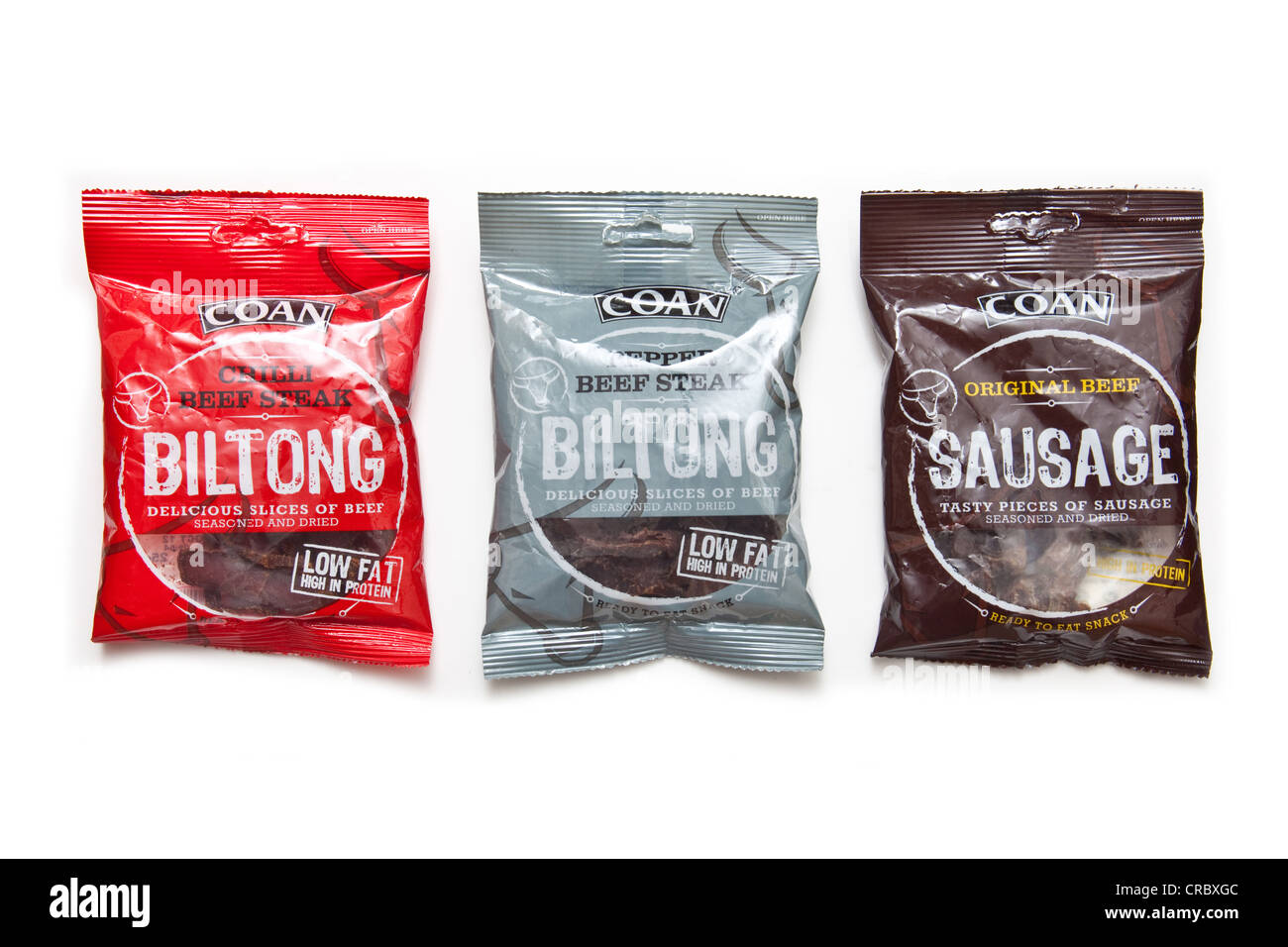 Packets of Coan Biltong (South African beef jerky) isolated on a white ...