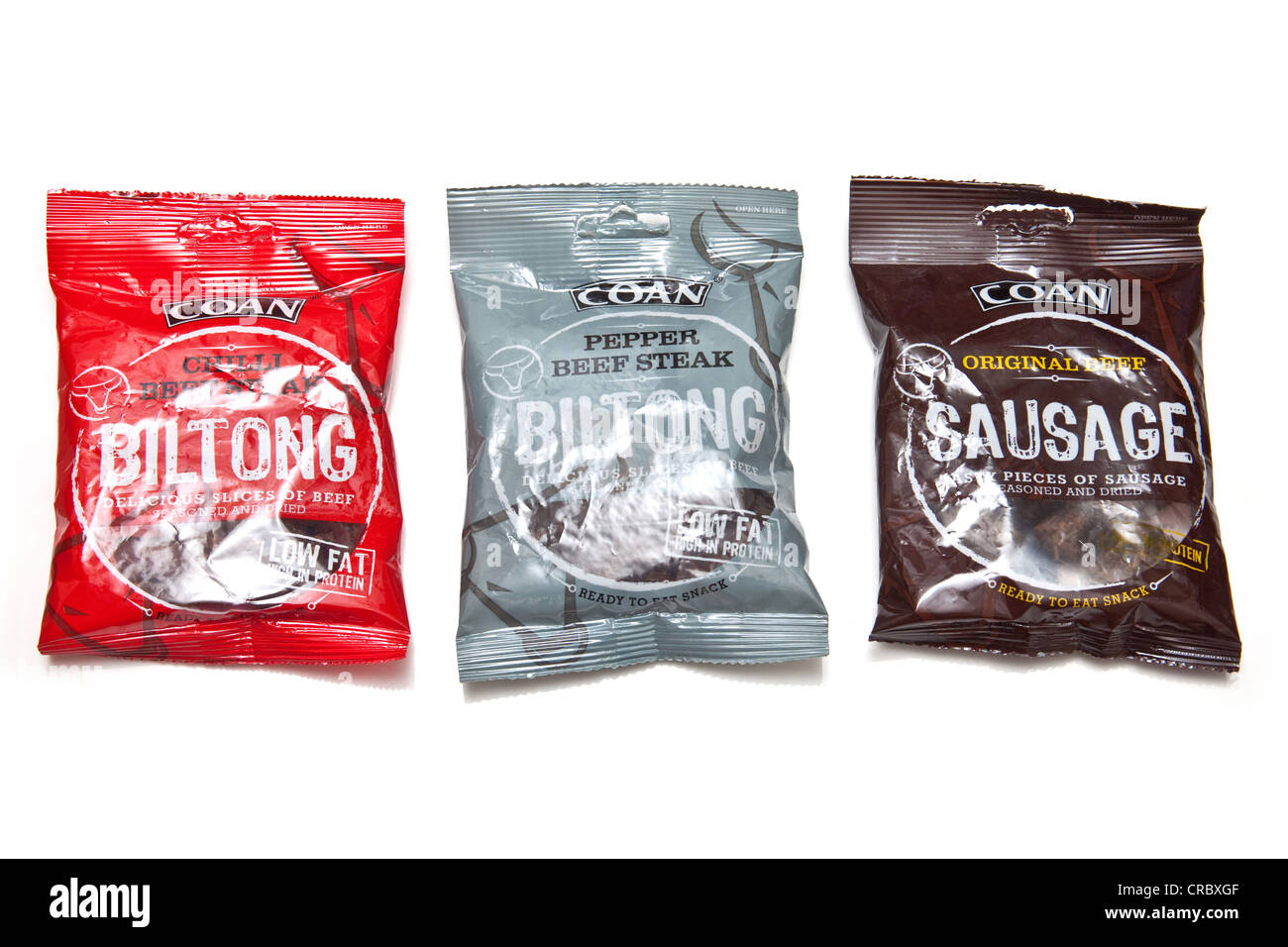 Packets of Coan Biltong (South African beef jerky) isolated on a white ...