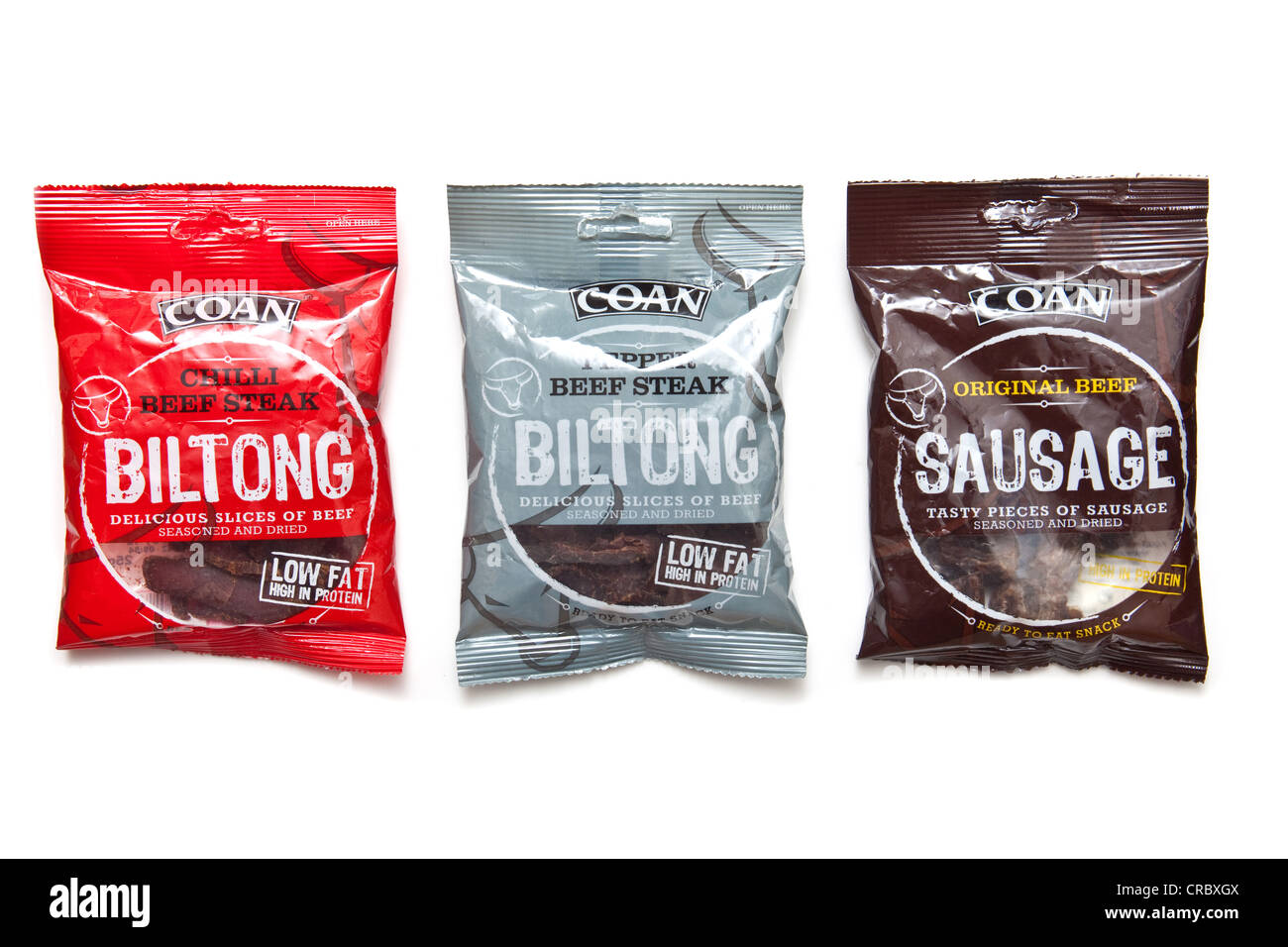 Packets of Coan Biltong (South African beef jerky) isolated on a white ...