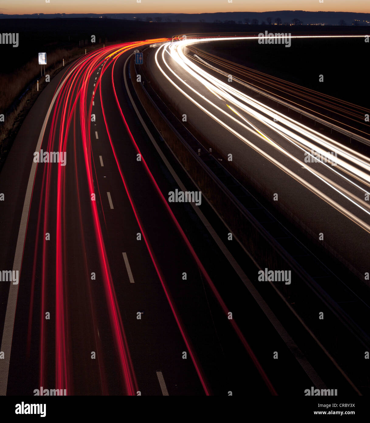 Cars moving fast on a highway Stock Photo - Alamy