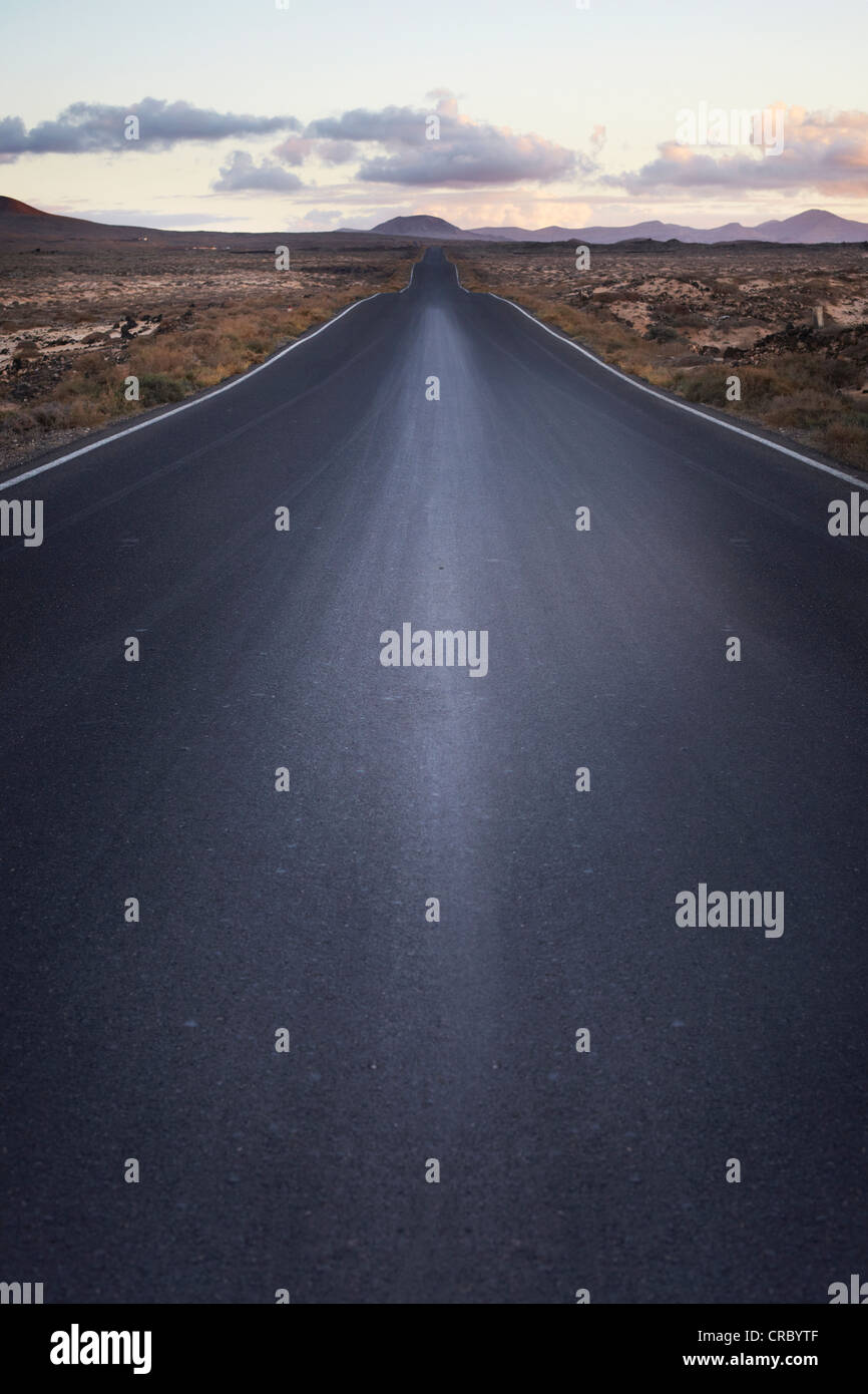 Paved road in rural landscape Stock Photo - Alamy