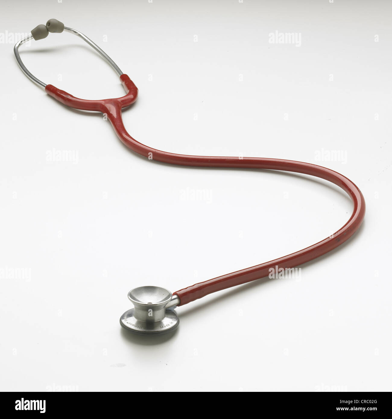 red doctor's stethoscope on white background Stock Photo - Alamy