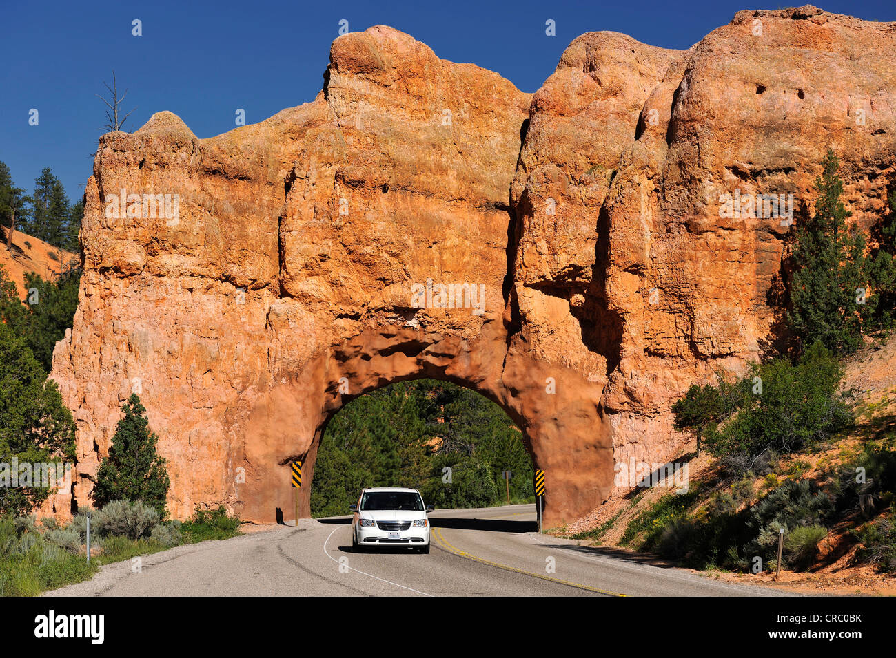 Rock arch in a red rock formation, road tunnel, Red Canyon, Utah, USA ...