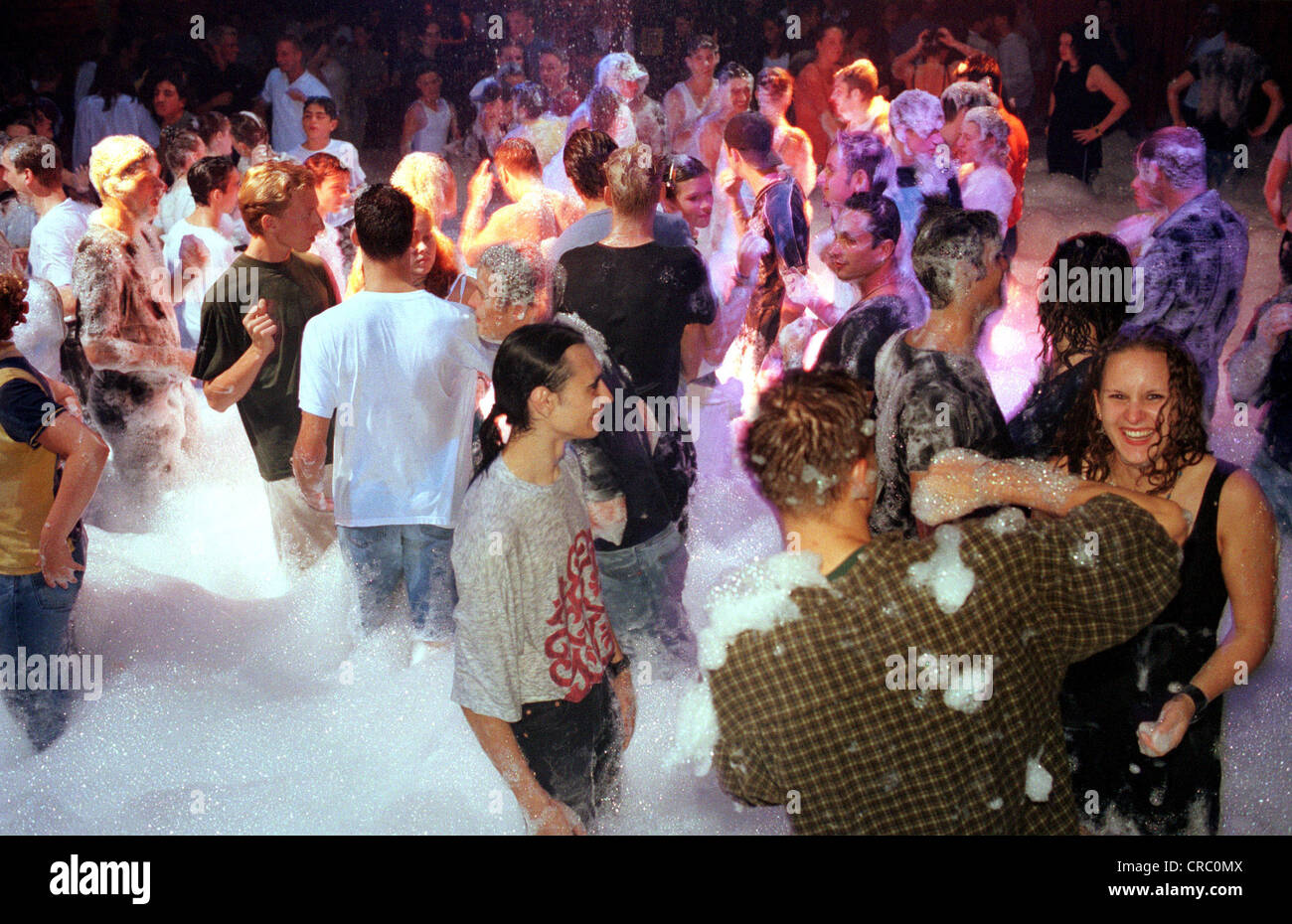 Dancing young people at a foam party in Bremen, Germany Stock Photo - Alamy