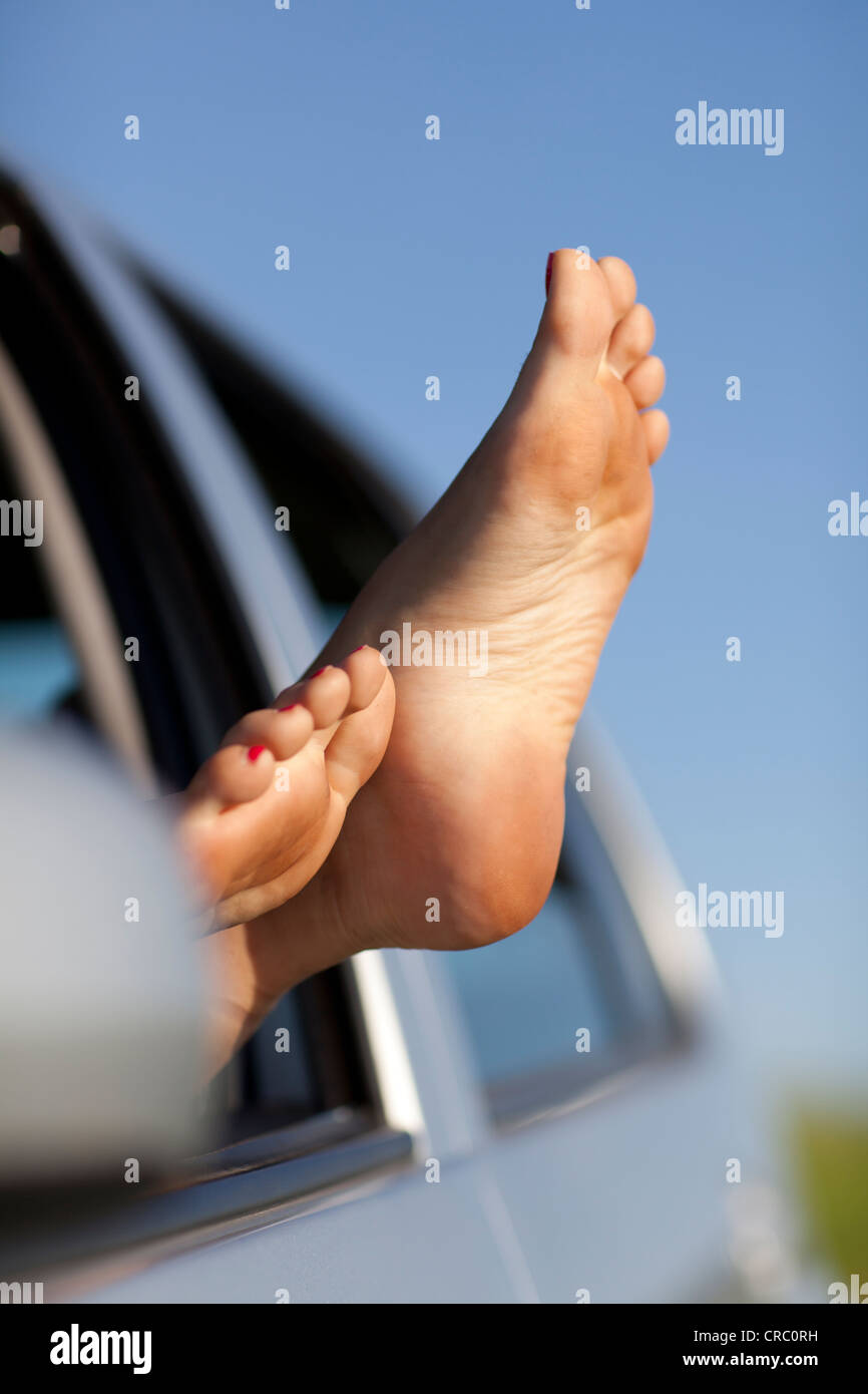 Feet from car in summer Stock Photo - Alamy