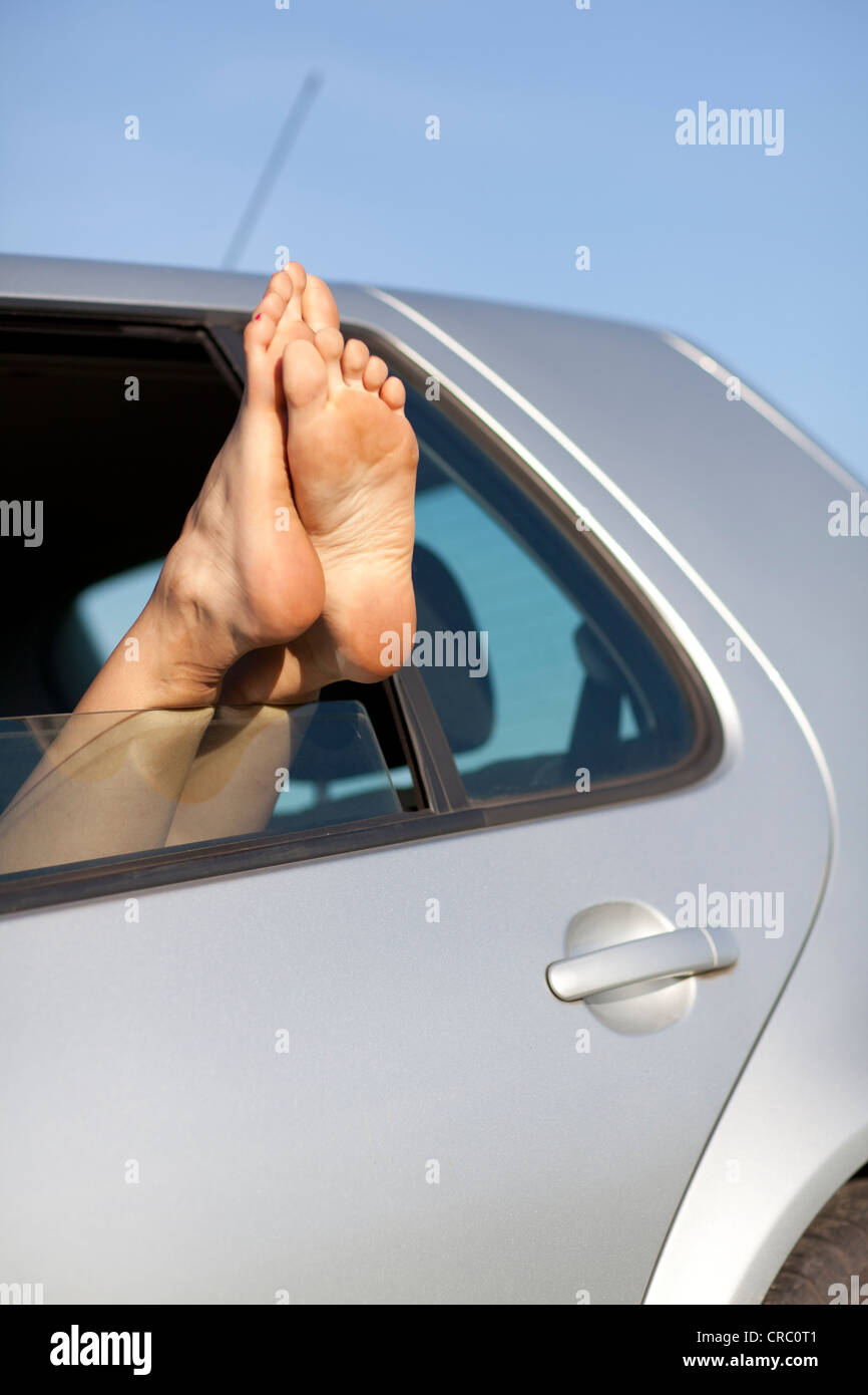 Feet from car in summer Stock Photo - Alamy