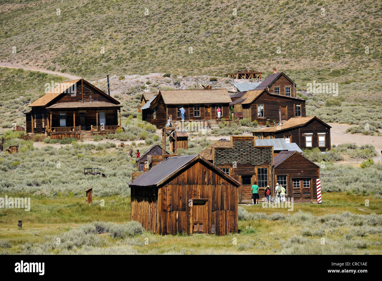 Tourists in the ghost town of Bodie, a former gold mining town, Bodie State Historic Park ...