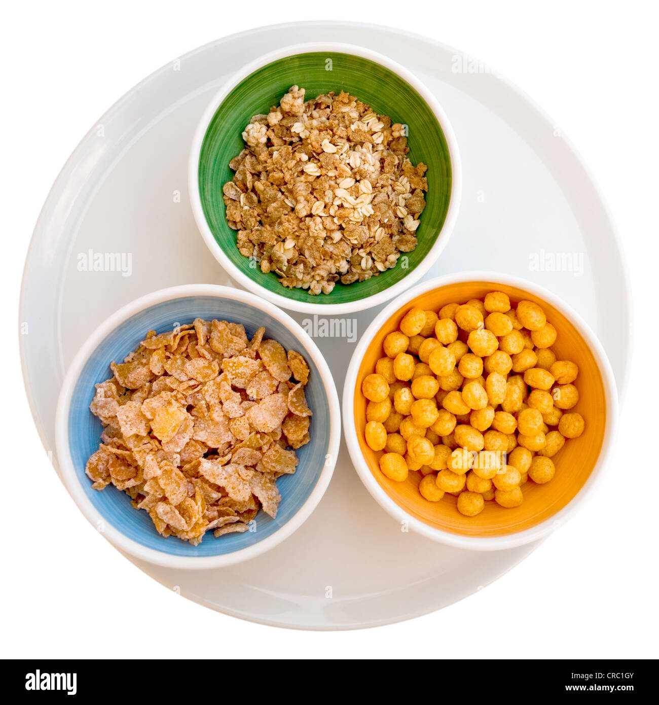 plate with three kind of cereals for breakfast isolated on white Stock ...