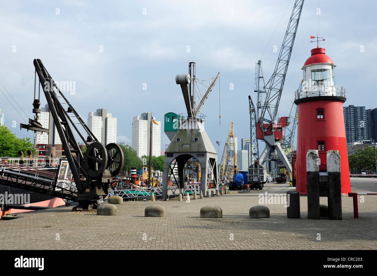 Red lighthouse and cranes in Leuvehaven harbour, part of the Maritime ...