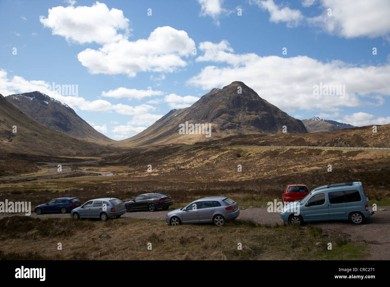 cars parked by walkers on rough path at glen etive glencoe highlands ...