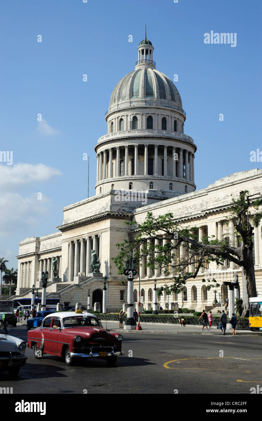 1950s vintage car in front of the Capitolio Nacional, a building in the ...