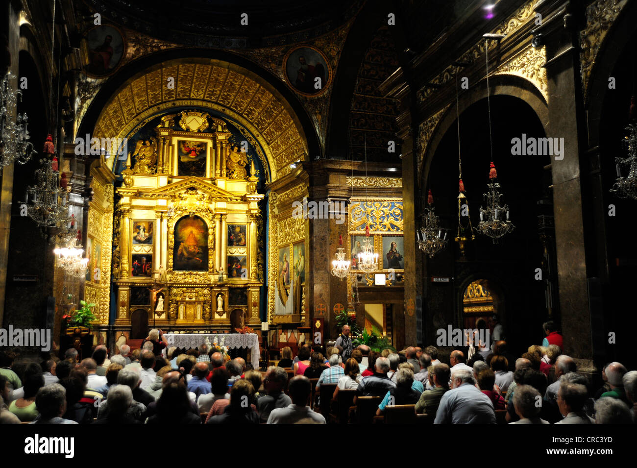 Place of pilgrimage, visitors in front of the church altar, monastery ...