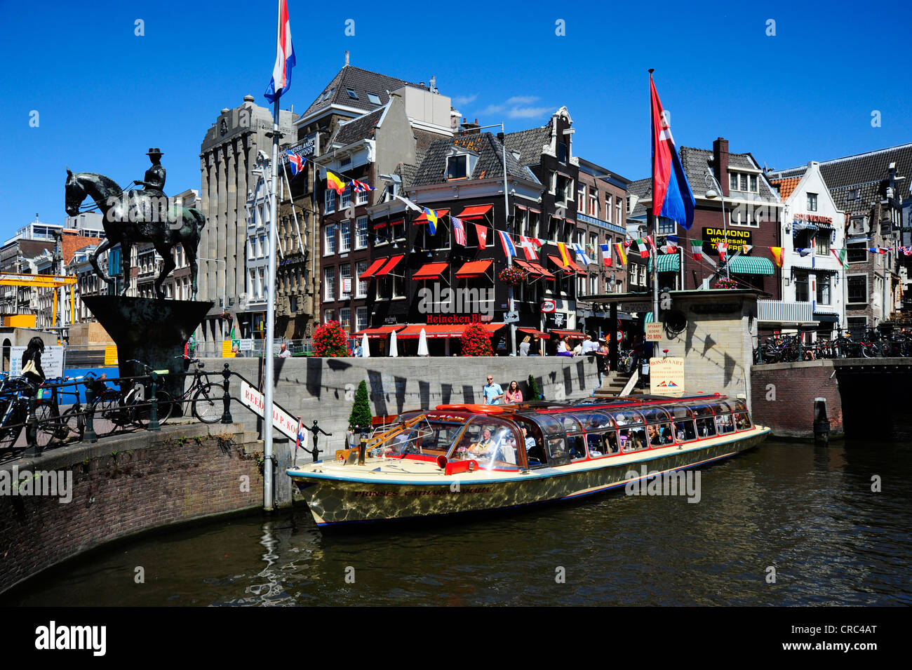 Excursion boat on the Oude Turfmarkt canal, historic district ...