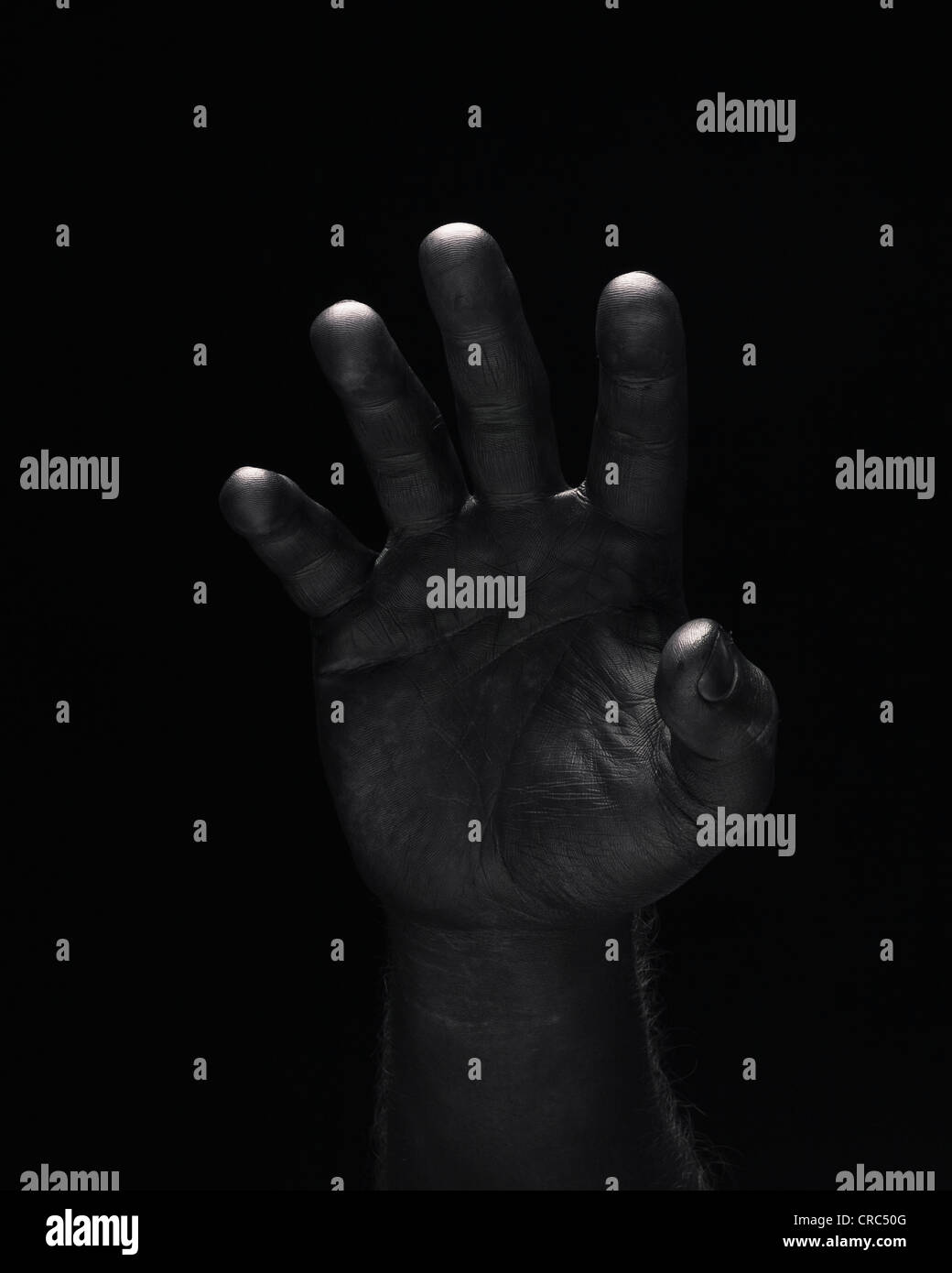 Black painted hand arm hi-res stock photography and images - Alamy