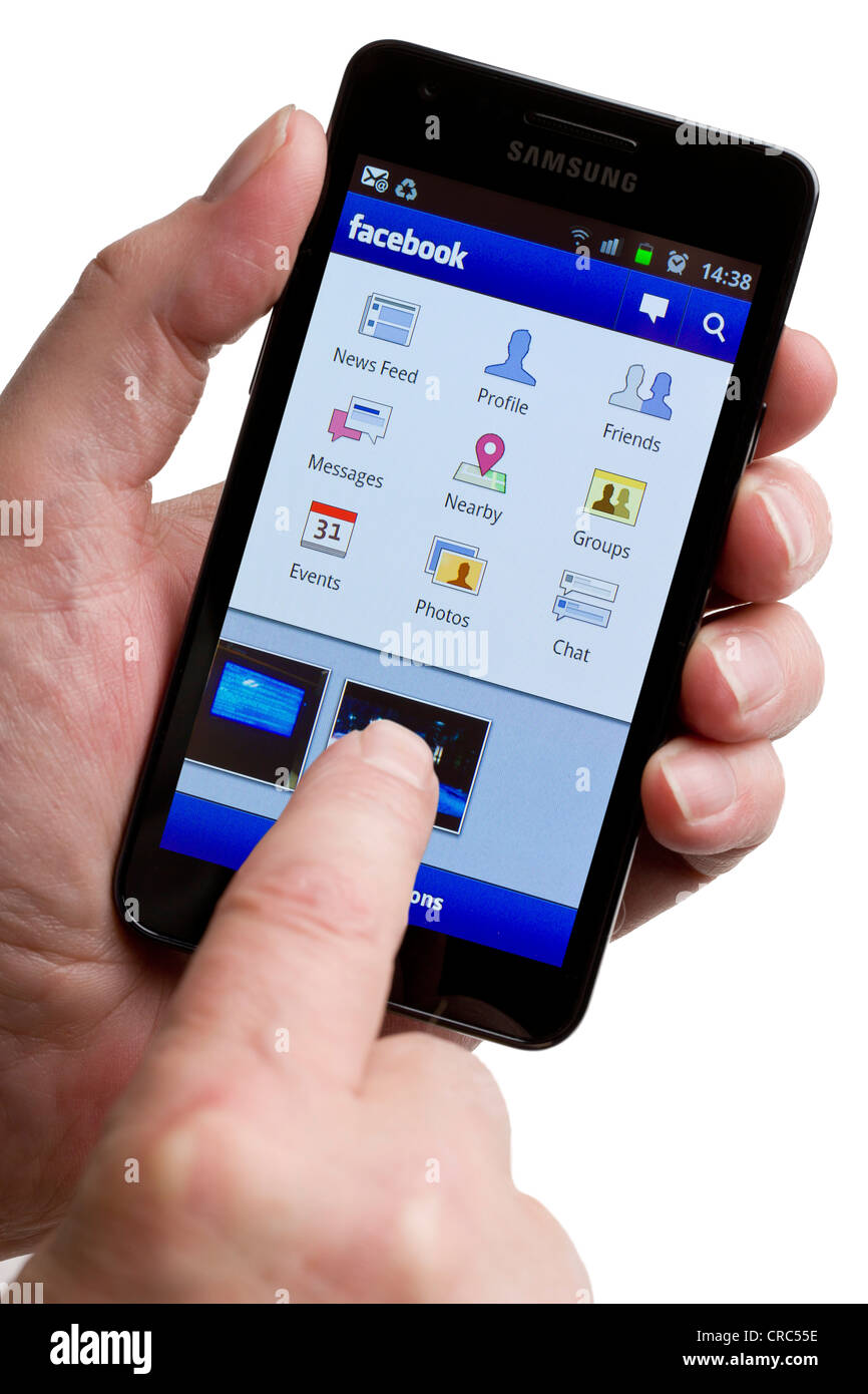 Using Facebook on a smartphone Stock Photo - Alamy