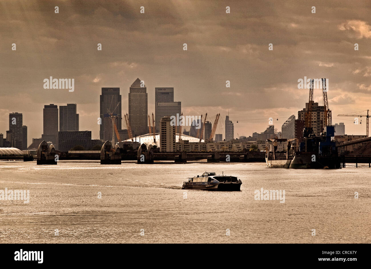 Thames Clipper water bus sailing towards Woolwich with the Millennium ...