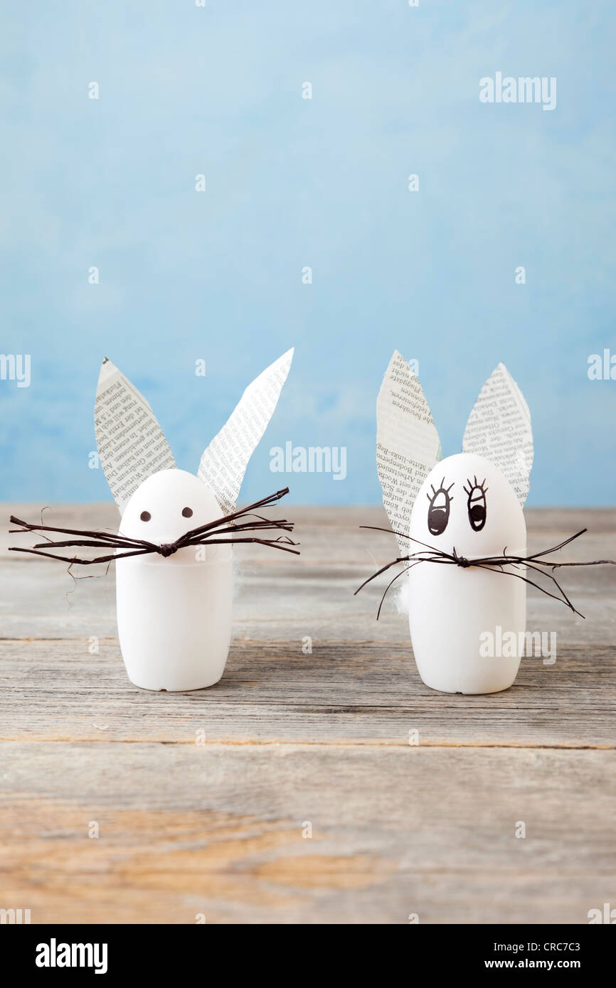 Rabbit decorations on wood counter Stock Photo - Alamy