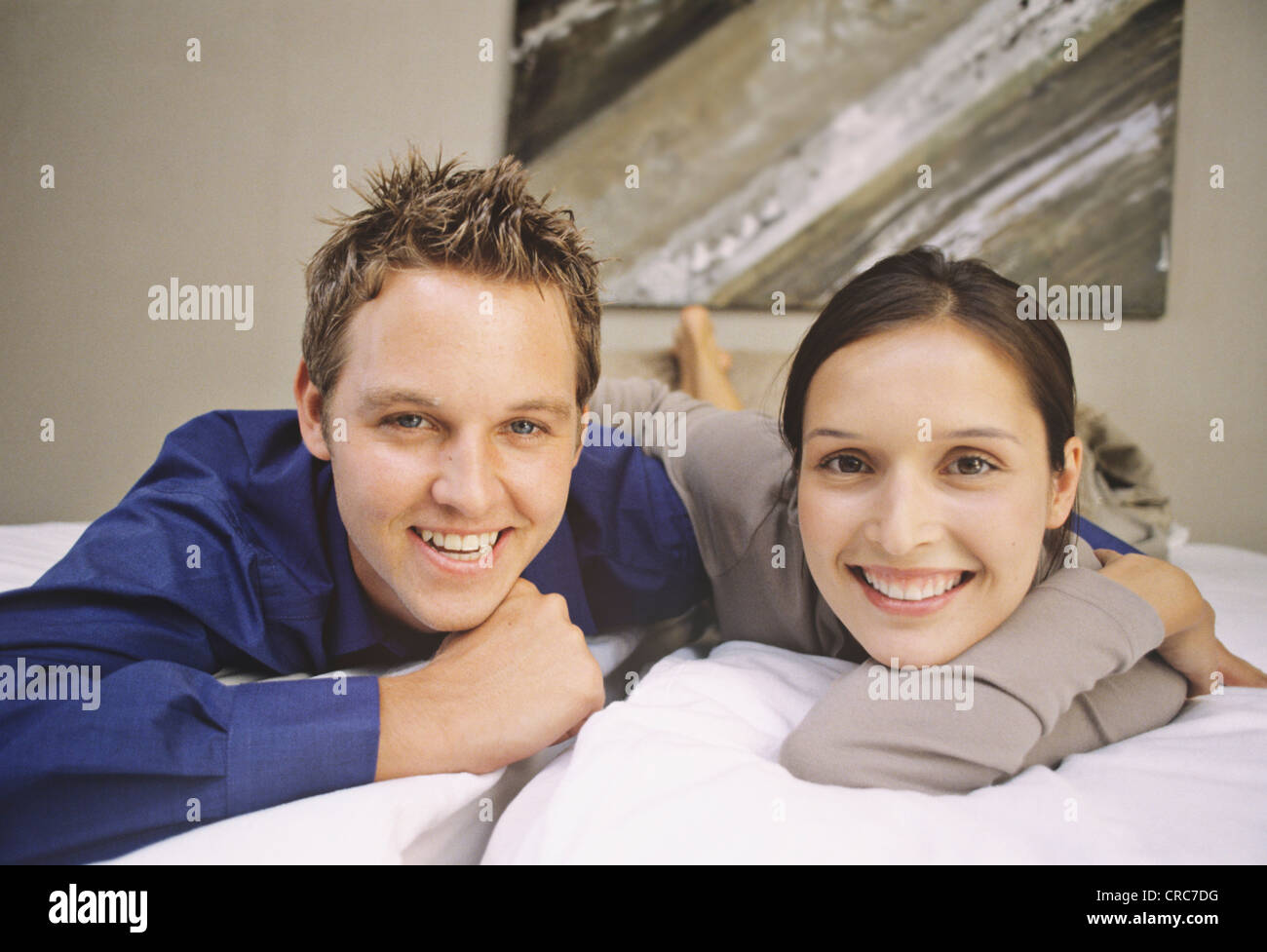 Married couple laying on bed hi-res stock photography and images - Alamy