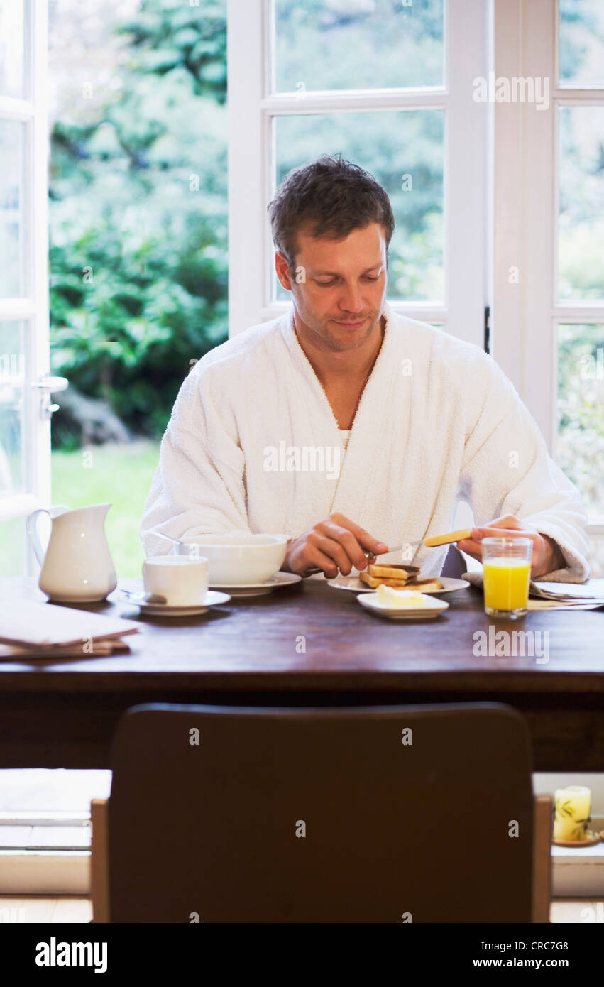 Man buttering bread hi-res stock photography and images - Alamy