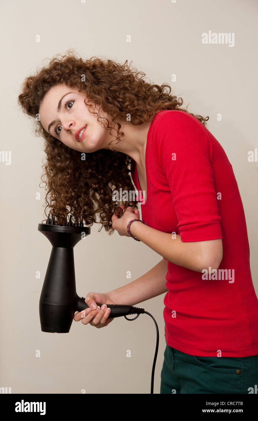 Teenage with hairdryer hi-res stock photography and images - Alamy
