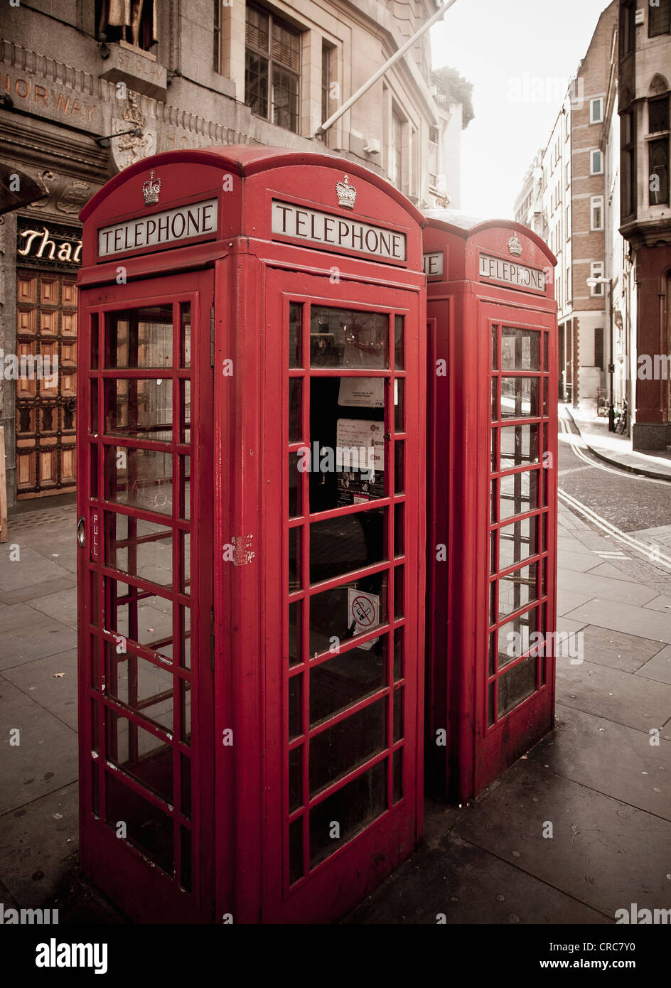 Red telephone box on city street Stock Photo - Alamy