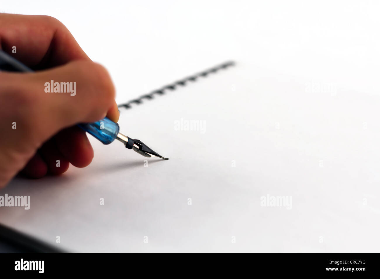 Writing on the notebook with pen Stock Photo - Alamy