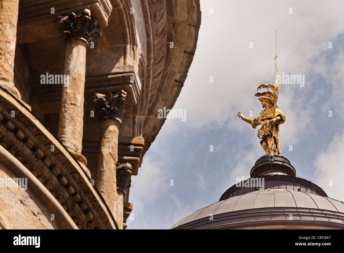 Gold statue on domed roof of cathedral Stock Photo - Alamy