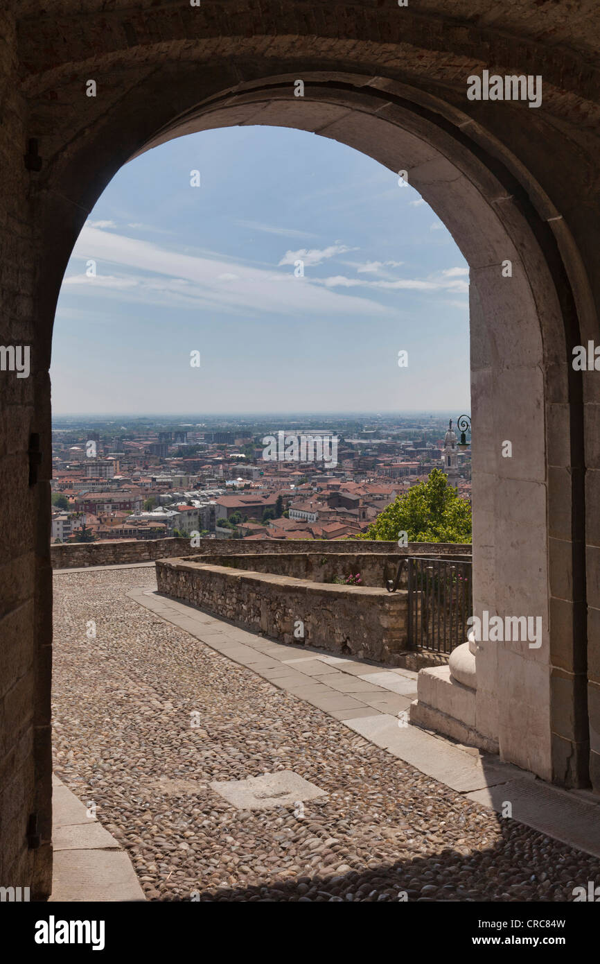 Stone archway overlooking city Stock Photo - Alamy