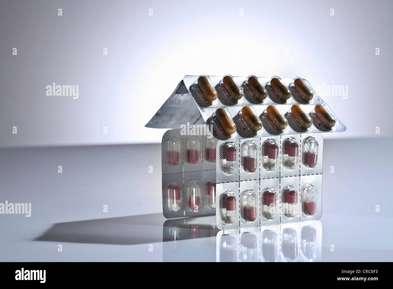 Blister packs of pills in shape of house Stock Photo - Alamy