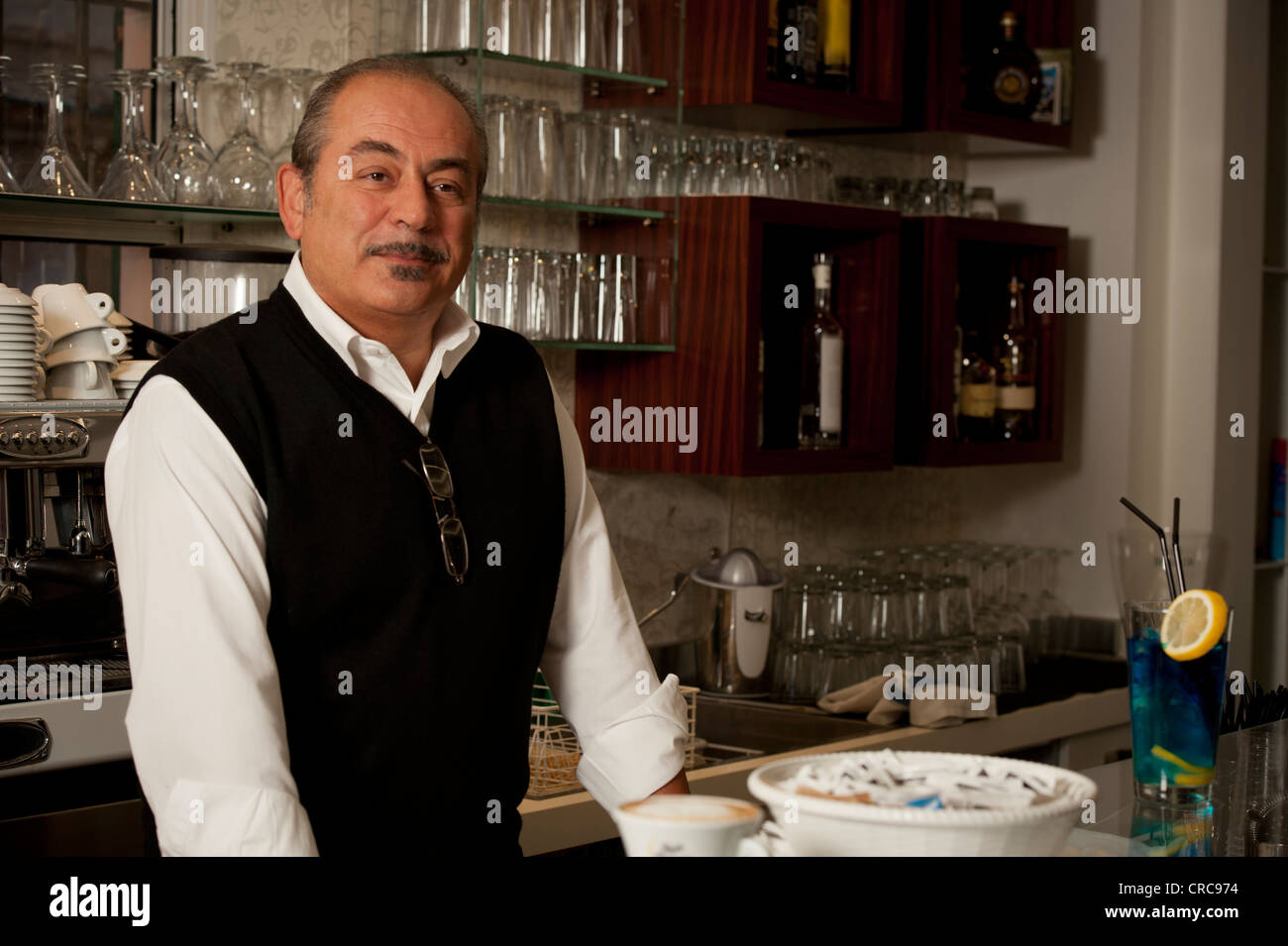 Italian male barista making espresso in his cafe Stock Photo - Alamy
