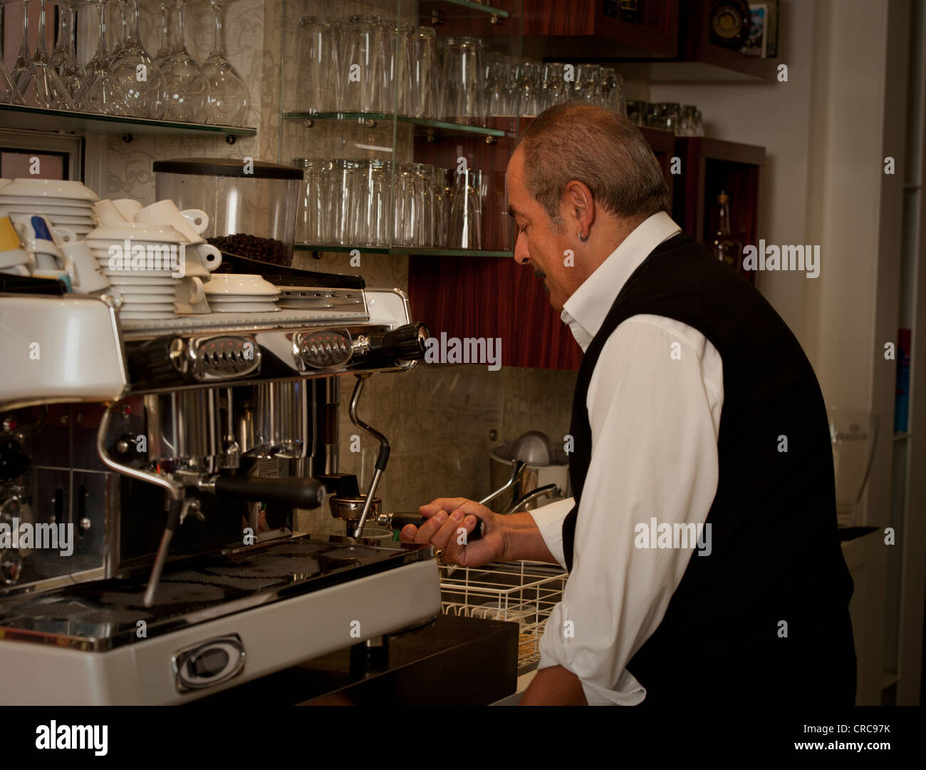 Italian male barista making espresso in his cafe Stock Photo - Alamy