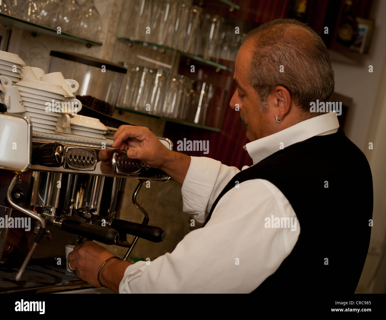 Italian male barista making espresso in his cafe Stock Photo - Alamy