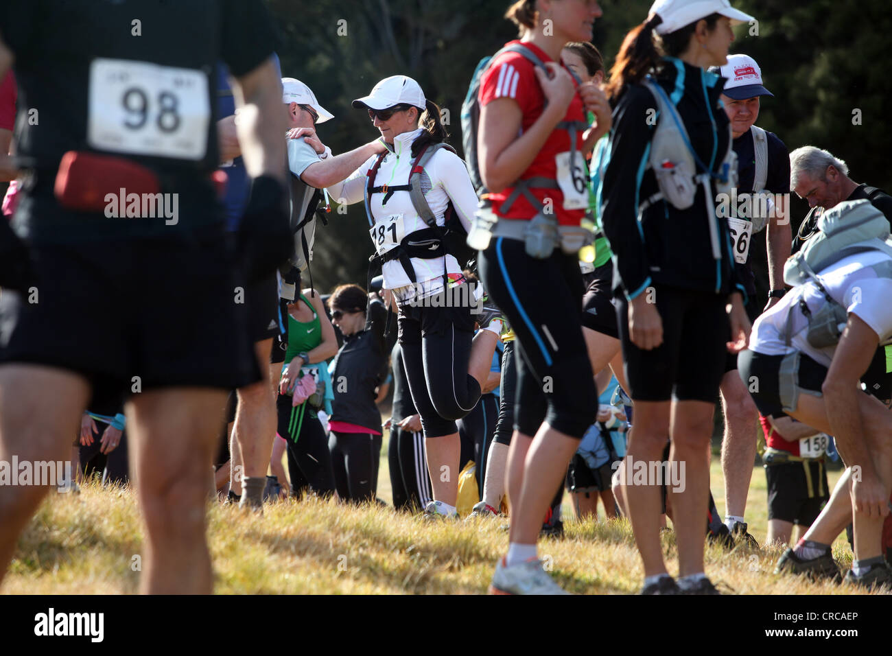Entrants limber up stretch before competing in the Abel Tasman Coastal ...