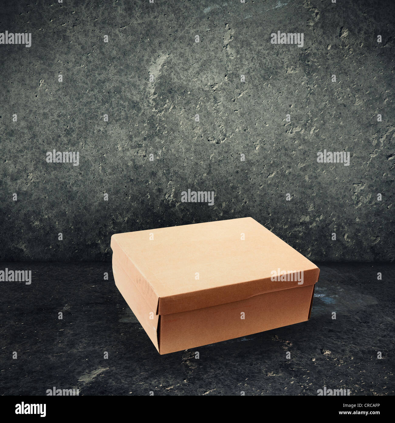 CArdboard box in vintage grungy concrete room Stock Photo - Alamy