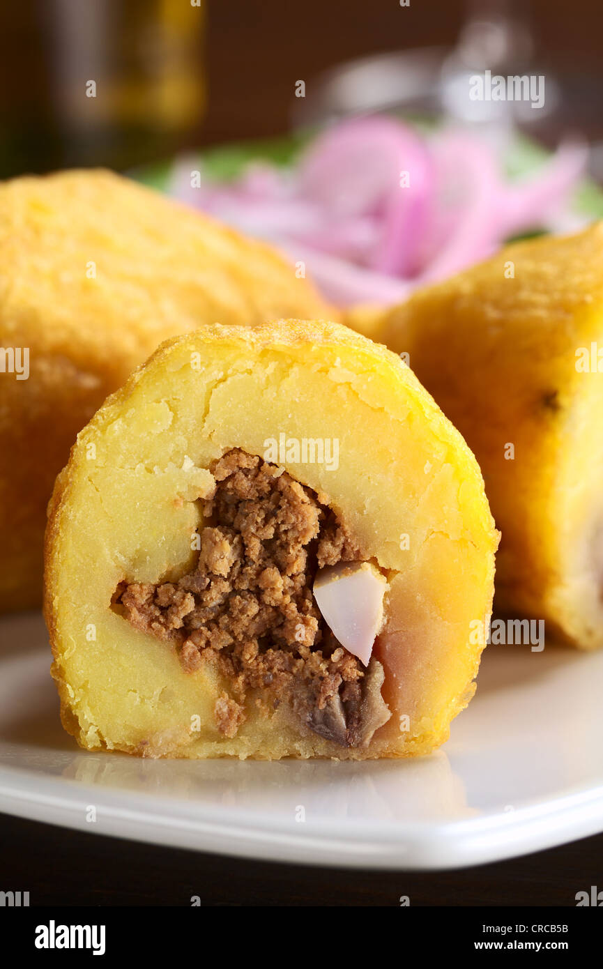 Peruvian dish called Papa Rellena (Stuffed Potato) made of mashed ...