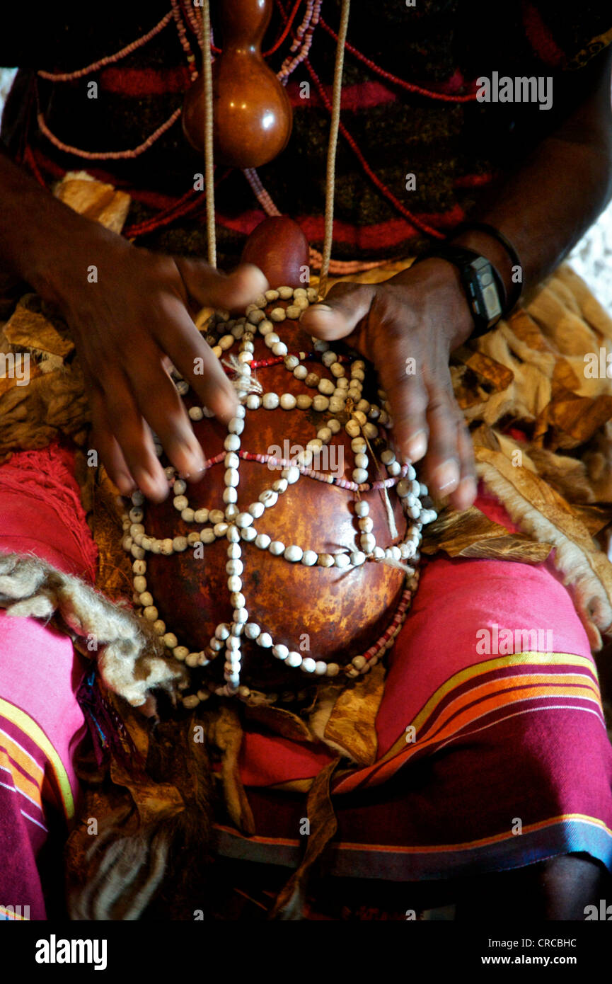 Woman playing traditional instrument, Kenya Stock Photo - Alamy