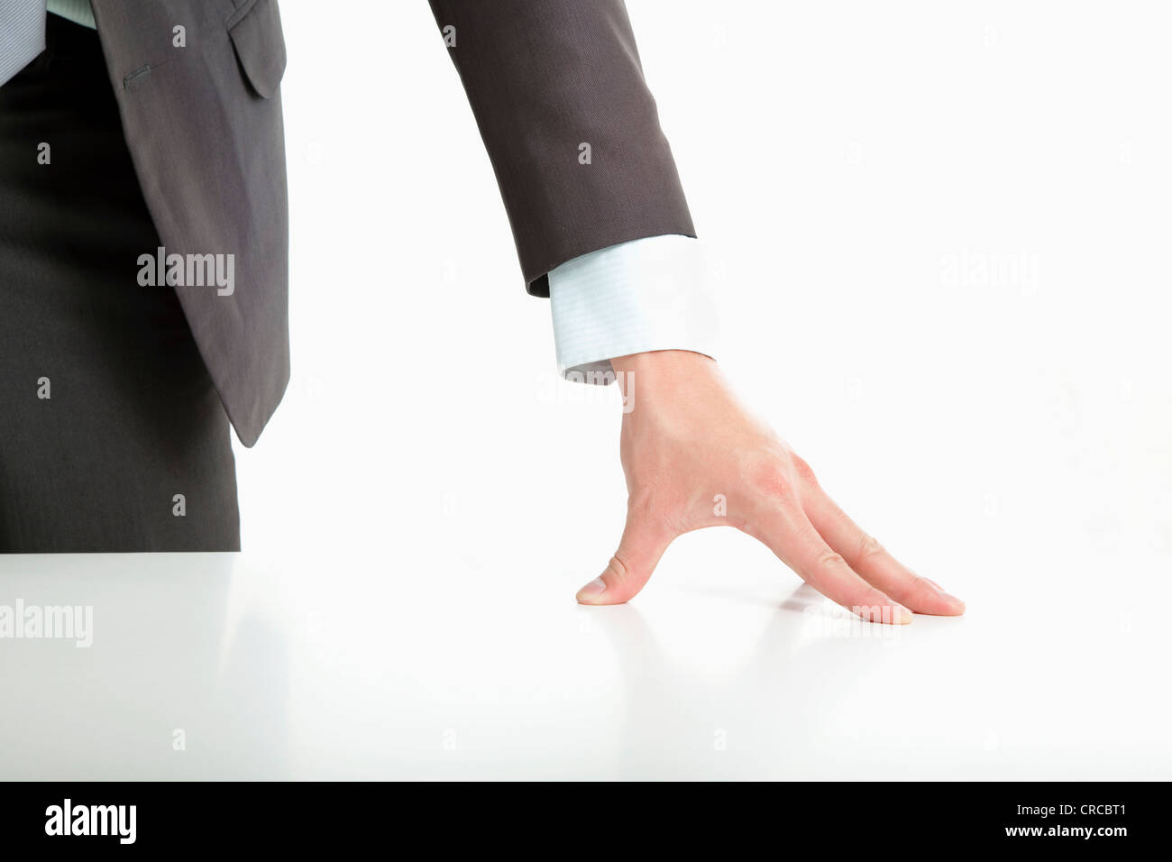 businessman 's hand put on the table Stock Photo - Alamy