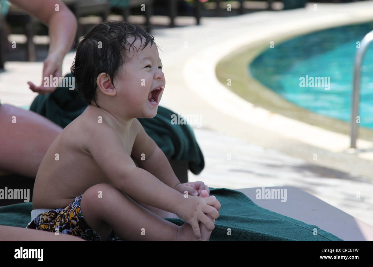 Infant crying beach hi-res stock photography and images - Alamy