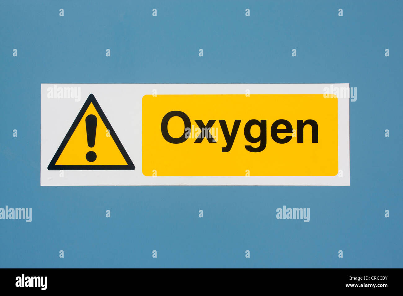 Oxygen yellow warning sign on blue door First aid storage at lifeguard ...
