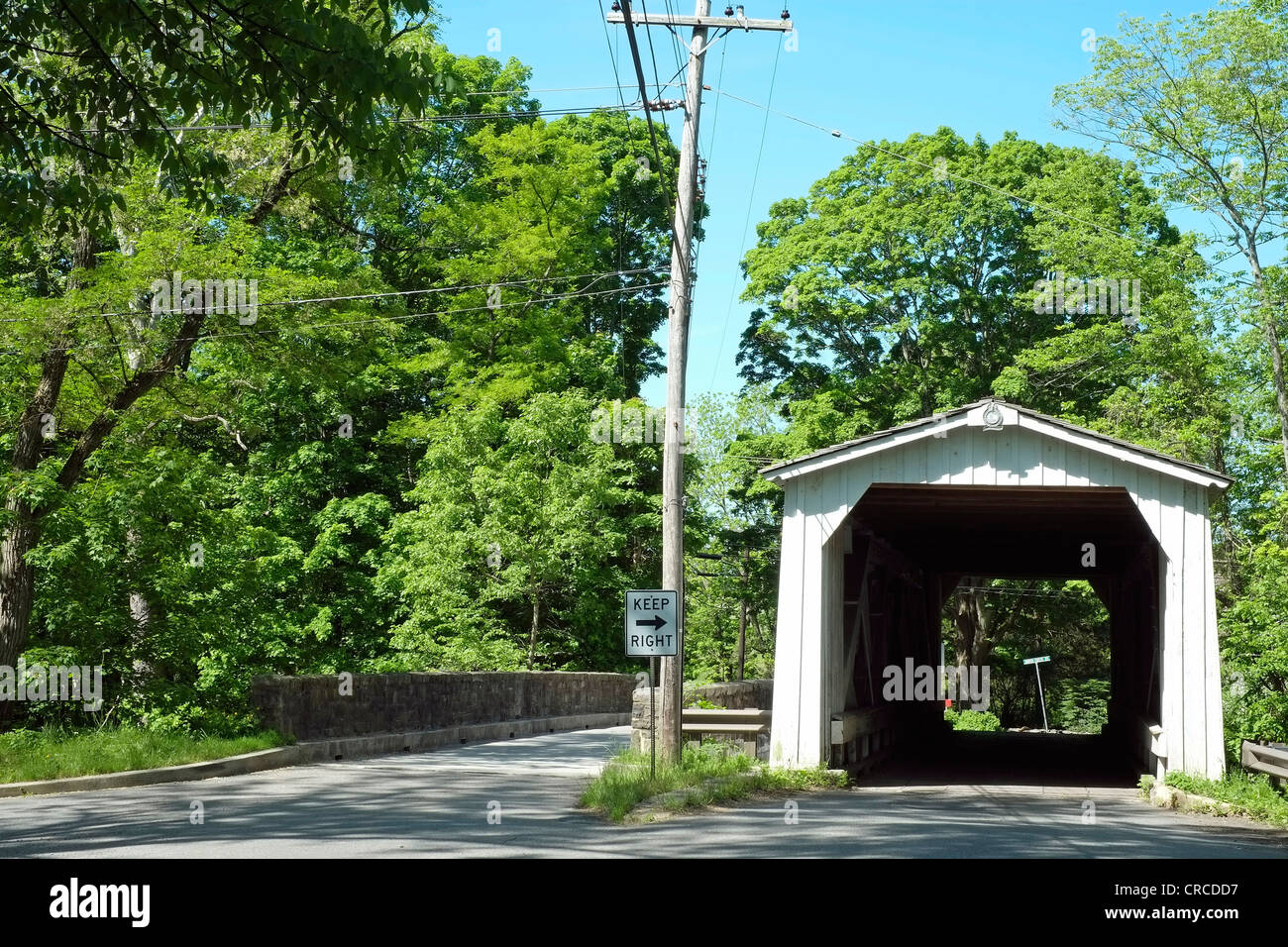 Covered bridge and road Stock Photo - Alamy