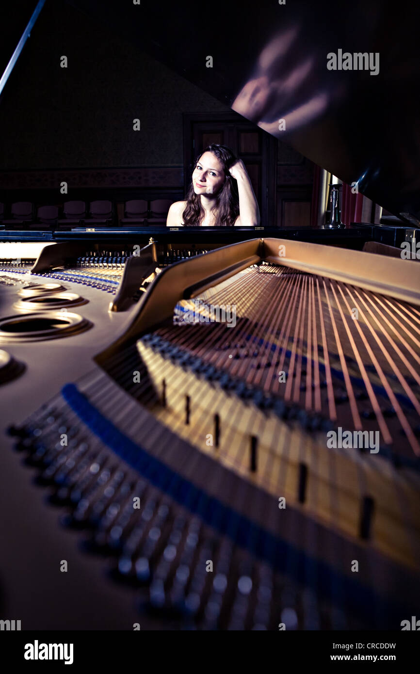 indoor portrait of a young female piano player Stock Photo - Alamy