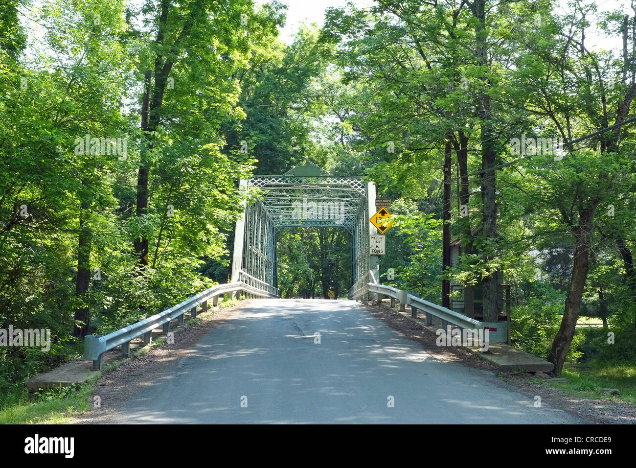 Steel bridge on a country lane Stock Photo - Alamy