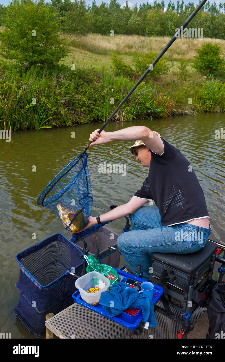Man pole fishing for carp at Lake near Bagworth, Leicestershire Stock ...