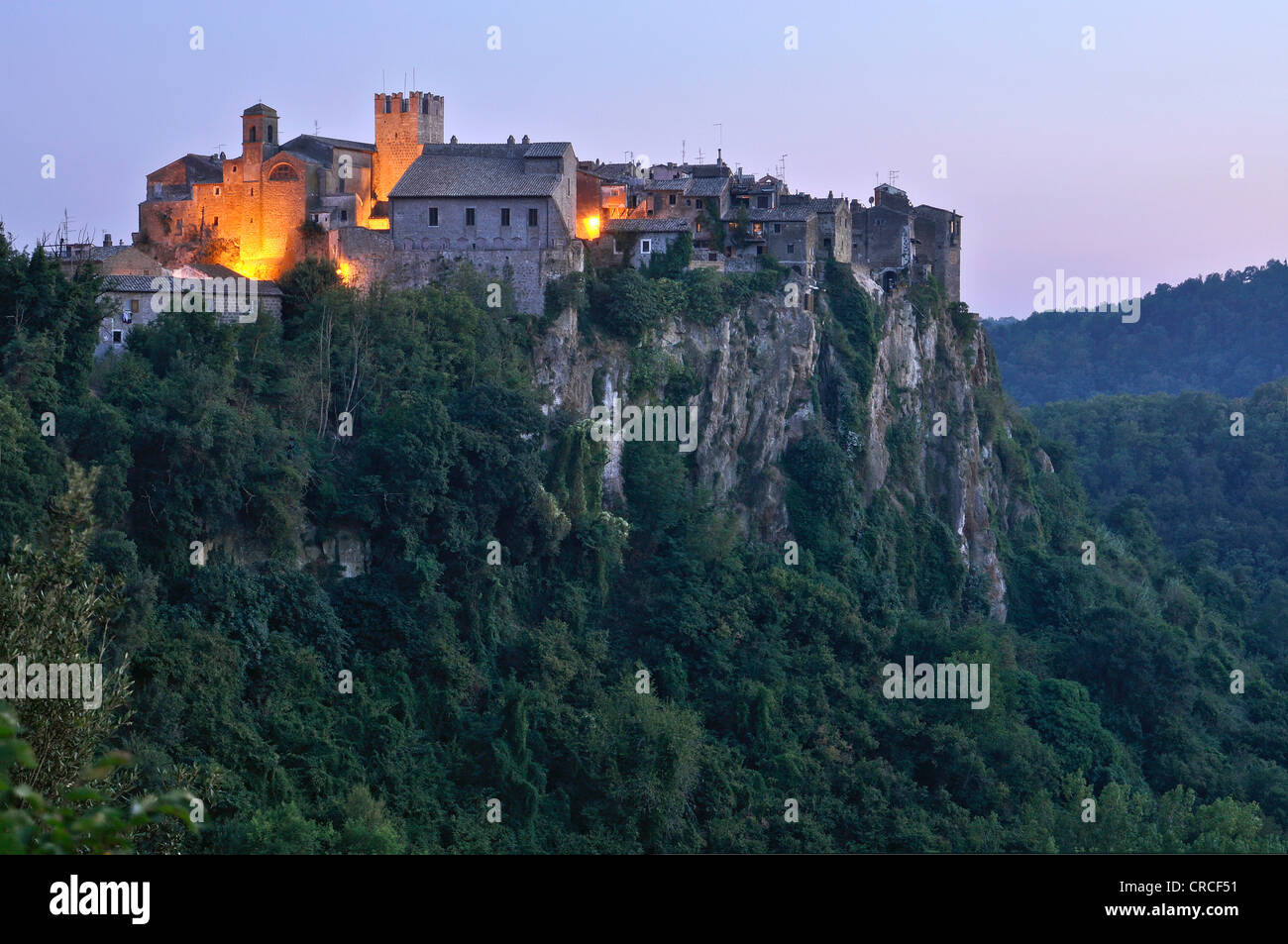 Medieval town of Vecchia Calcata on a plateau of tufa rock at sunset ...