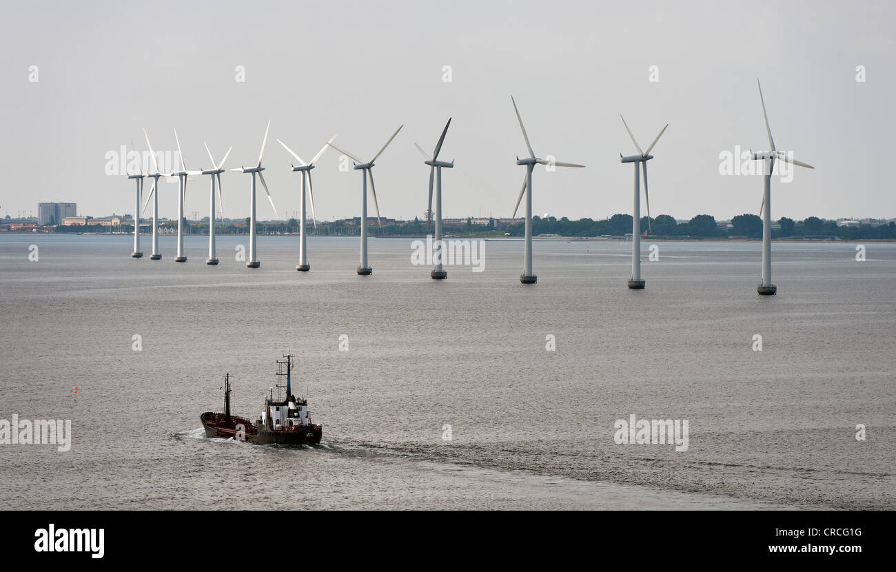 Cargo ship sailing in front of an offshore wind farm in the Øresund ...