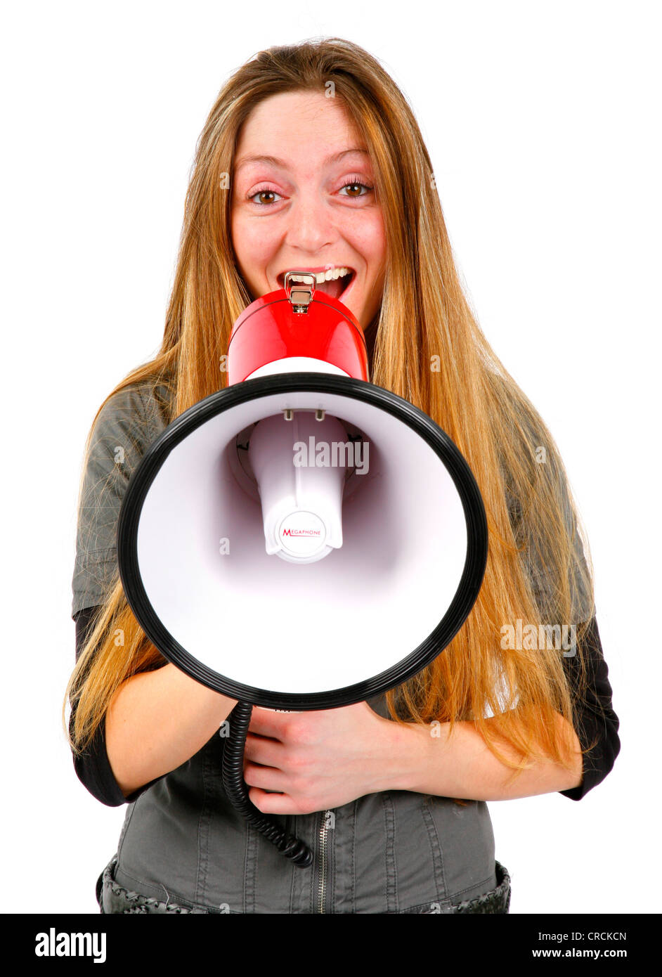 young handsome women screaming into the megaphone Stock Photo - Alamy