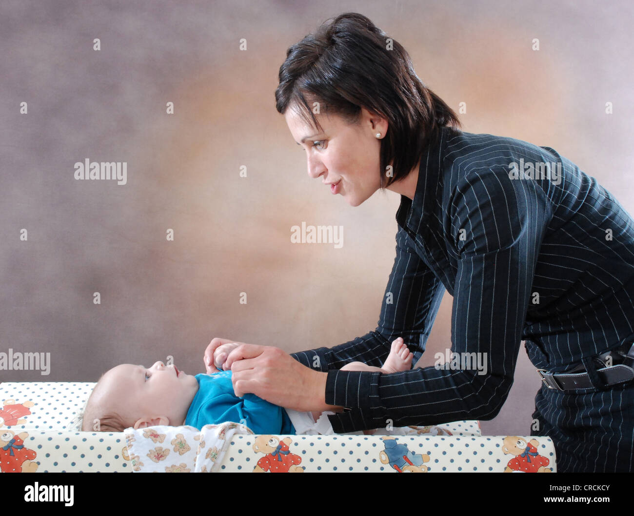 Two women changing diaper hi-res stock photography and images - Alamy