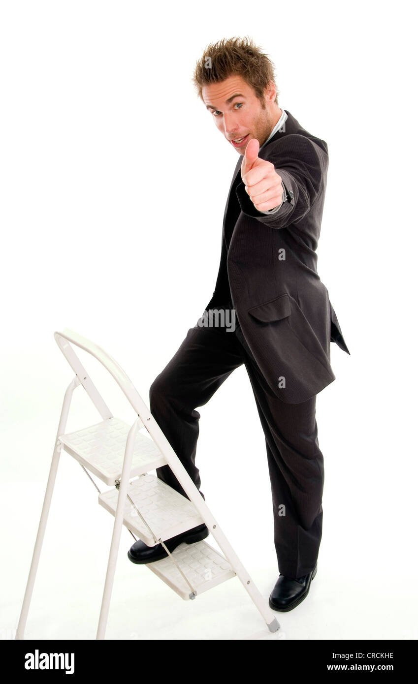 young businessman on job ladder, thumb up Stock Photo - Alamy