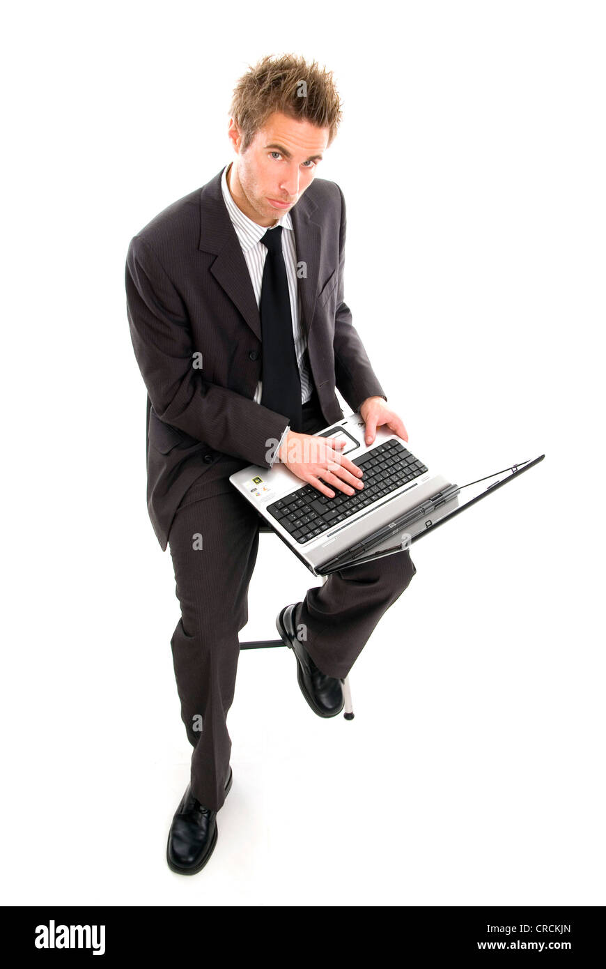 young businessman using a laptop Stock Photo - Alamy
